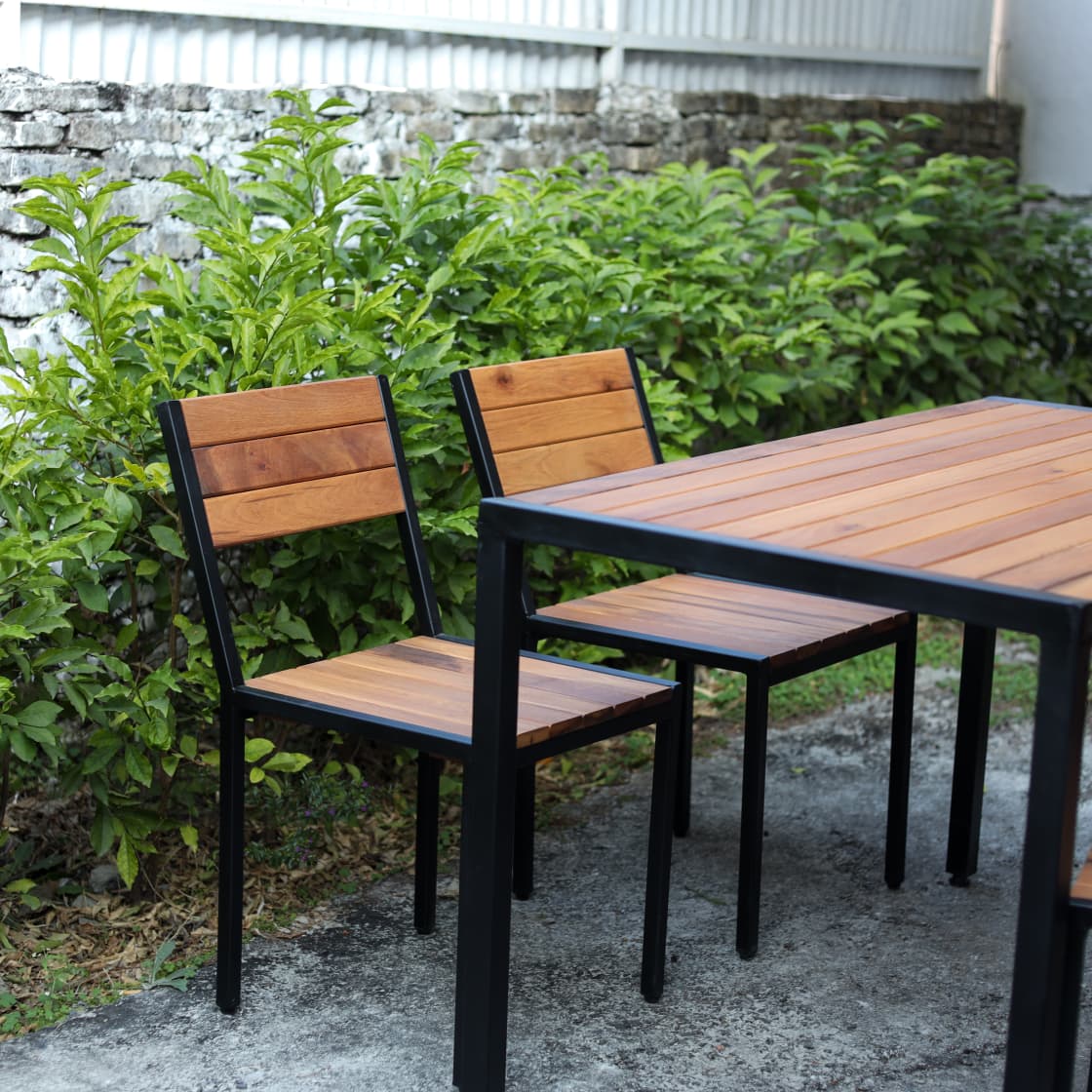 A compact 4-seater outdoor dining set handcrafted with Agrath wood and ...